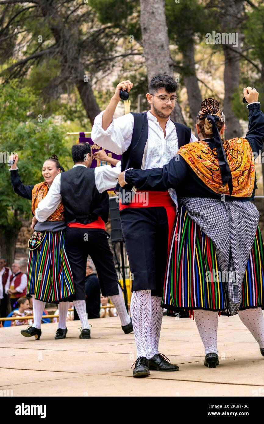 Spanish people wearing traditional clothes dancing Stock Photo - Alamy