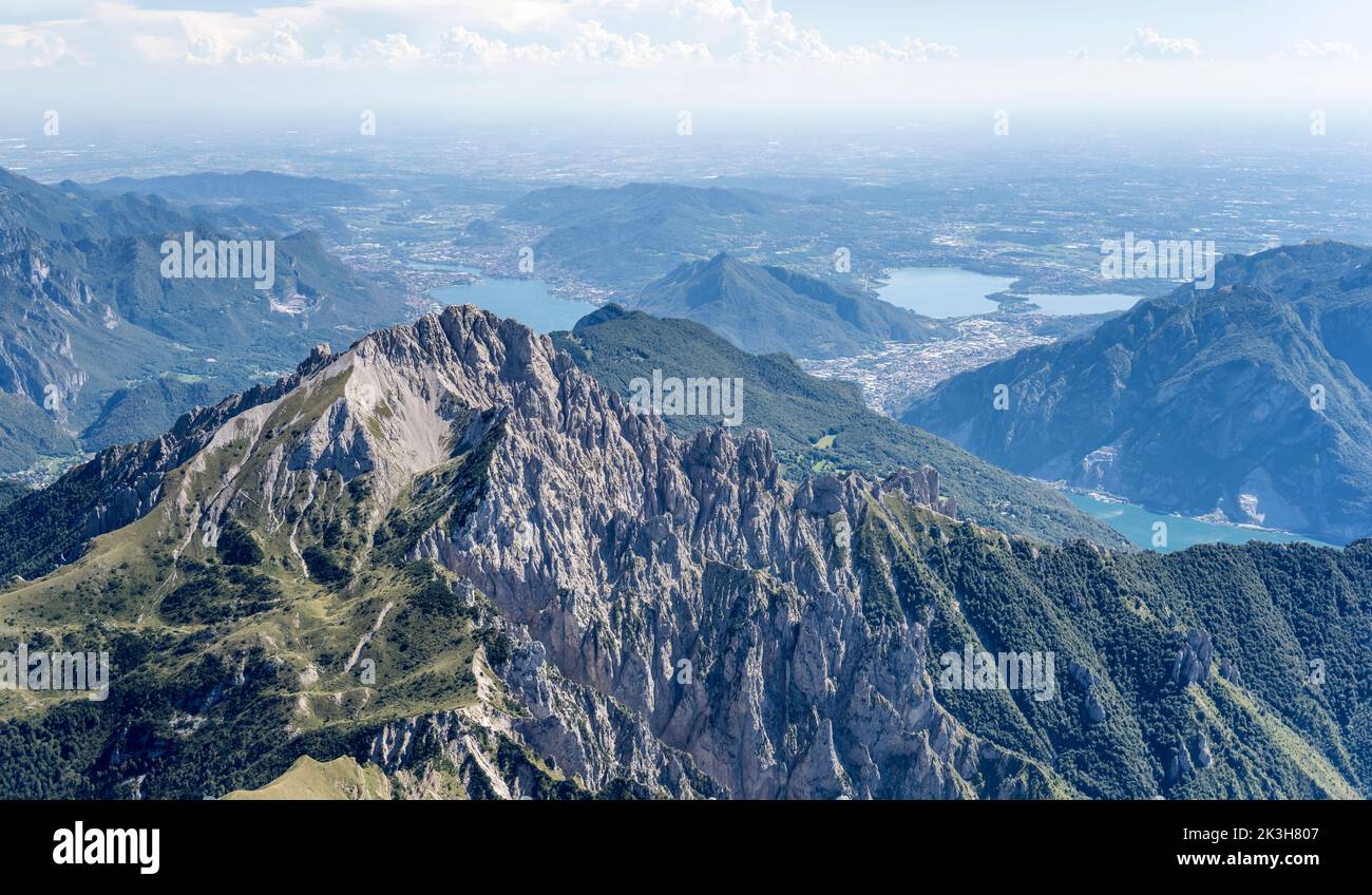 aerial shot, from a glider, of Grignetta peak with Brianza lakes in ...
