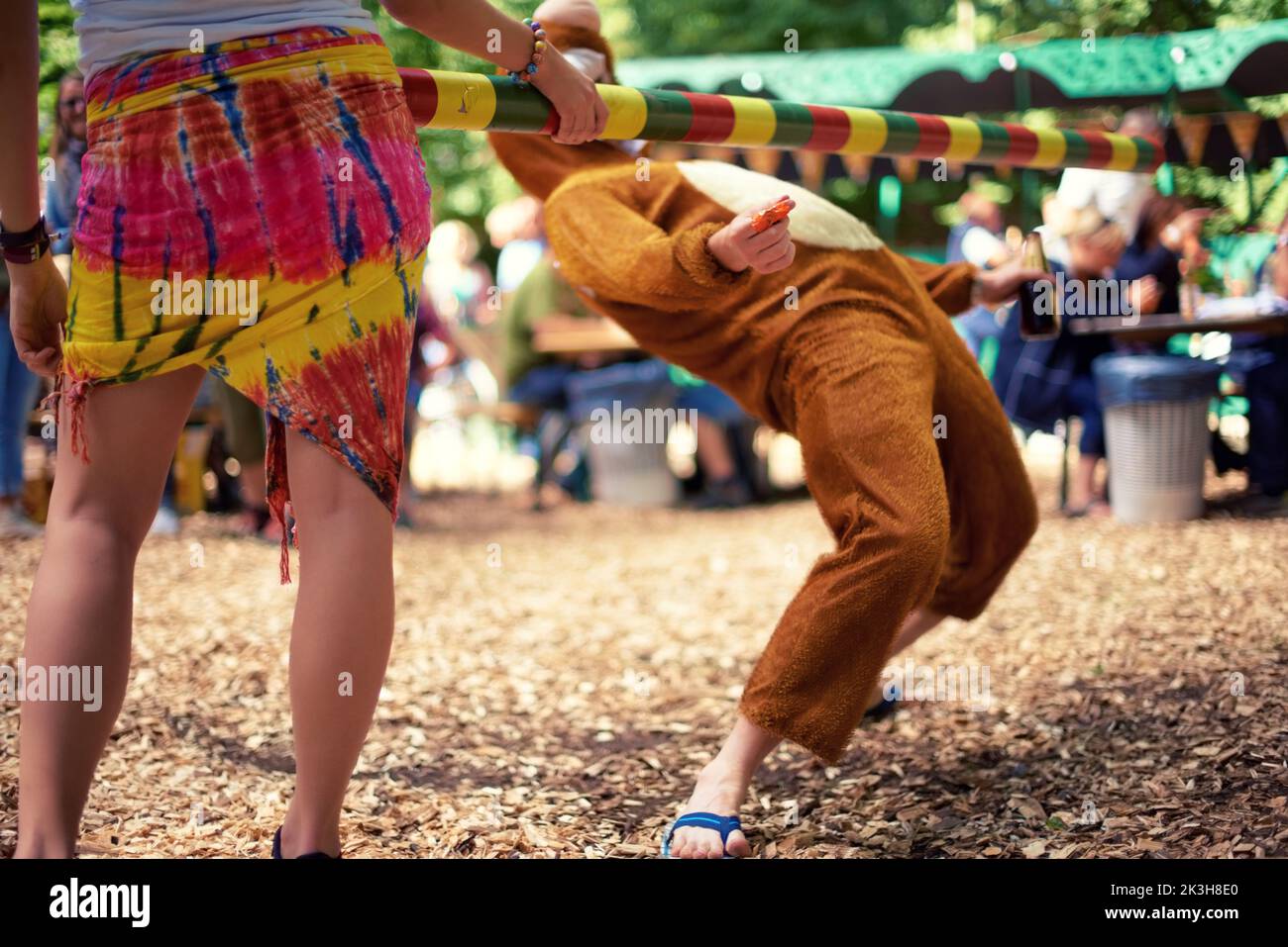Not going to make it...a man in an animal costume doing the limbo Stock ...