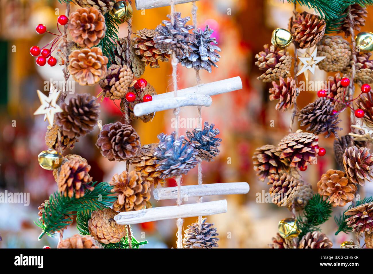 Colorful handmade Christmas decorations hanging on traditional winter ...