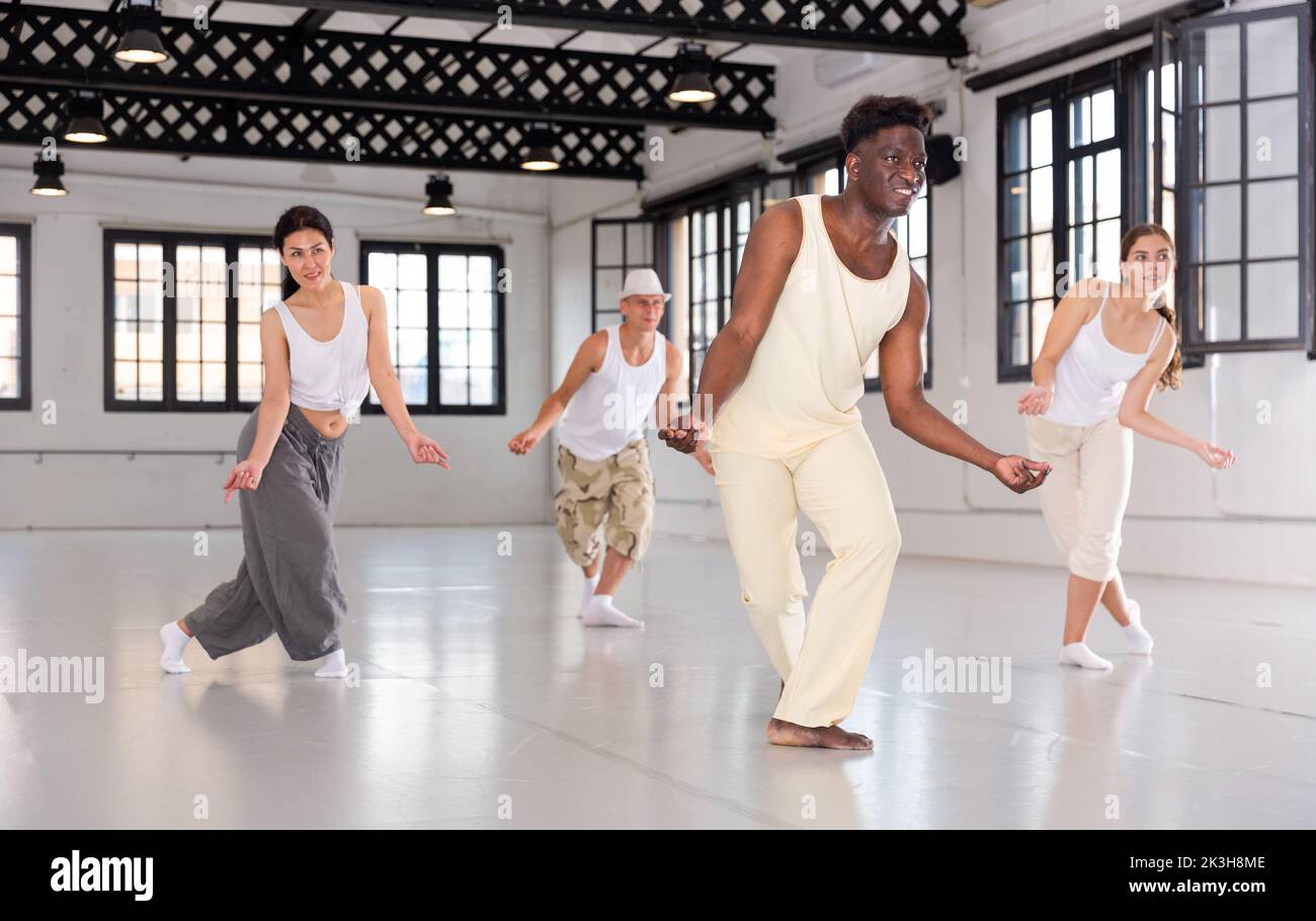 Group of young people learning modern dance movements Stock Photo - Alamy