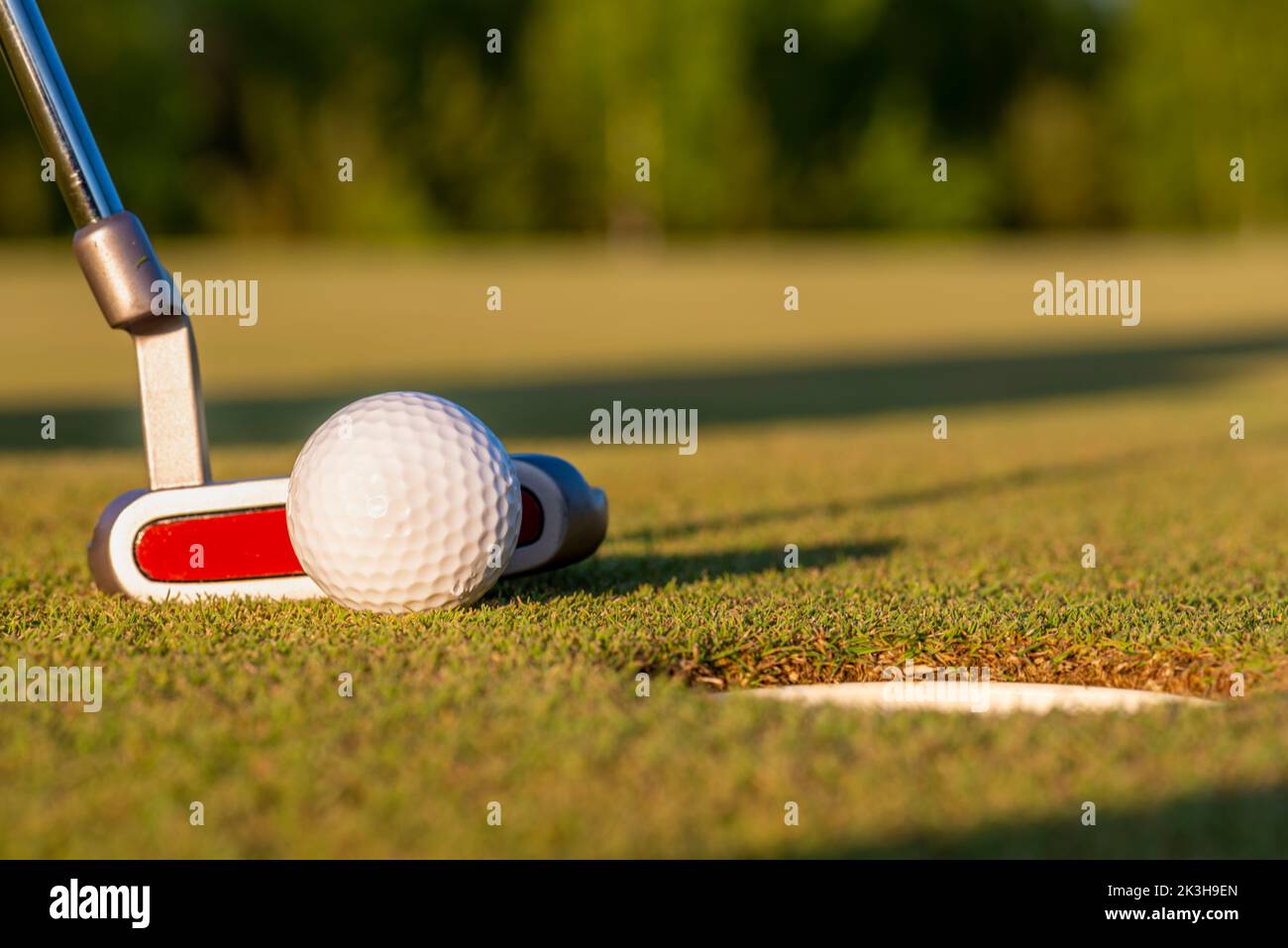 golf course background Golf balls on artificial grass with blur ...
