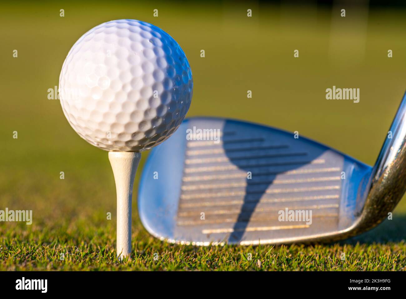 golf course background Golf balls on artificial grass with blur ...