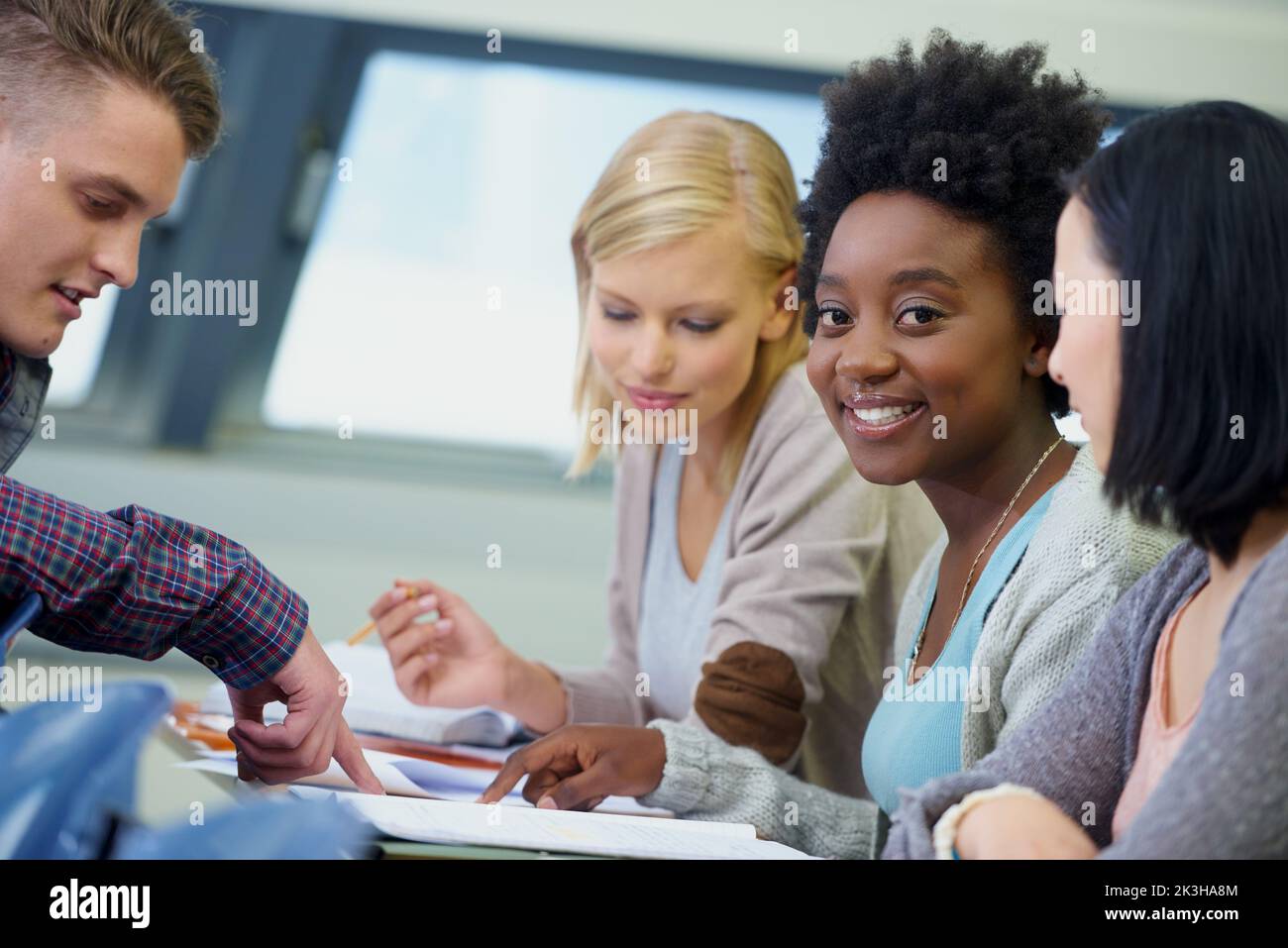 Everyone is contributing to the assignment. a group of college students ...