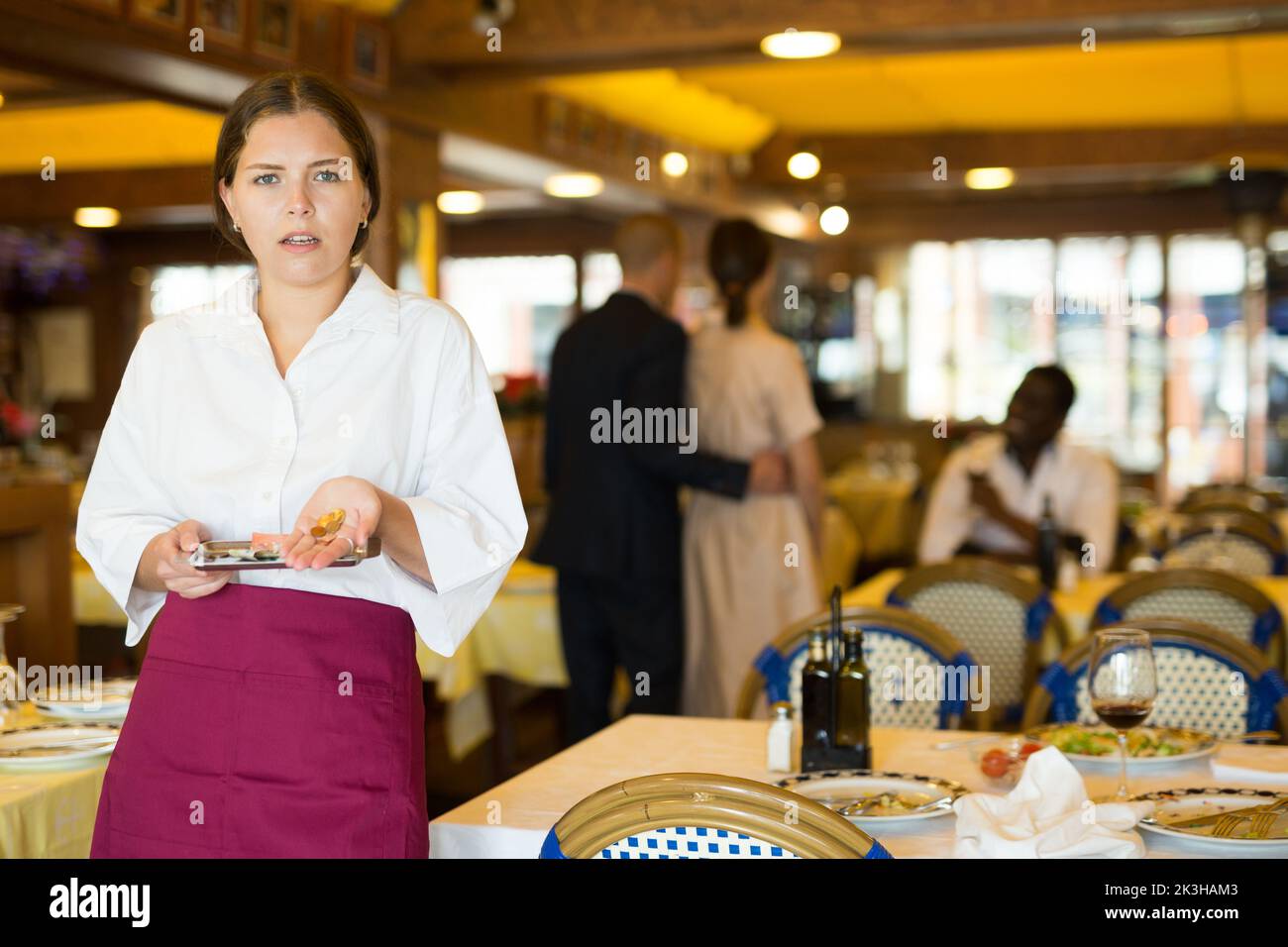 Waiter demonstrating his upset with little tips from restaurant ...