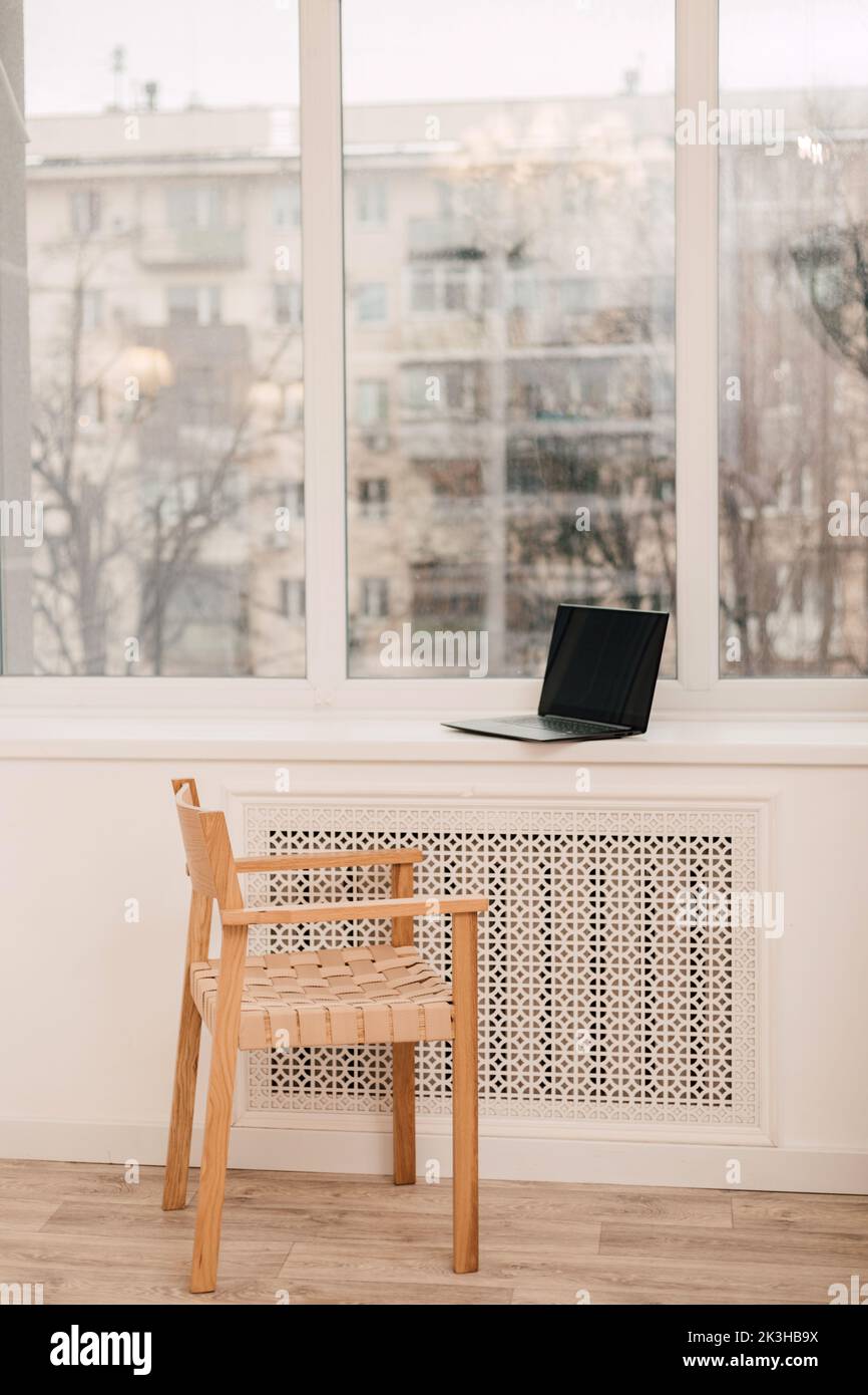 Modern comfortable workplace near the window with a laptop Stock Photo ...