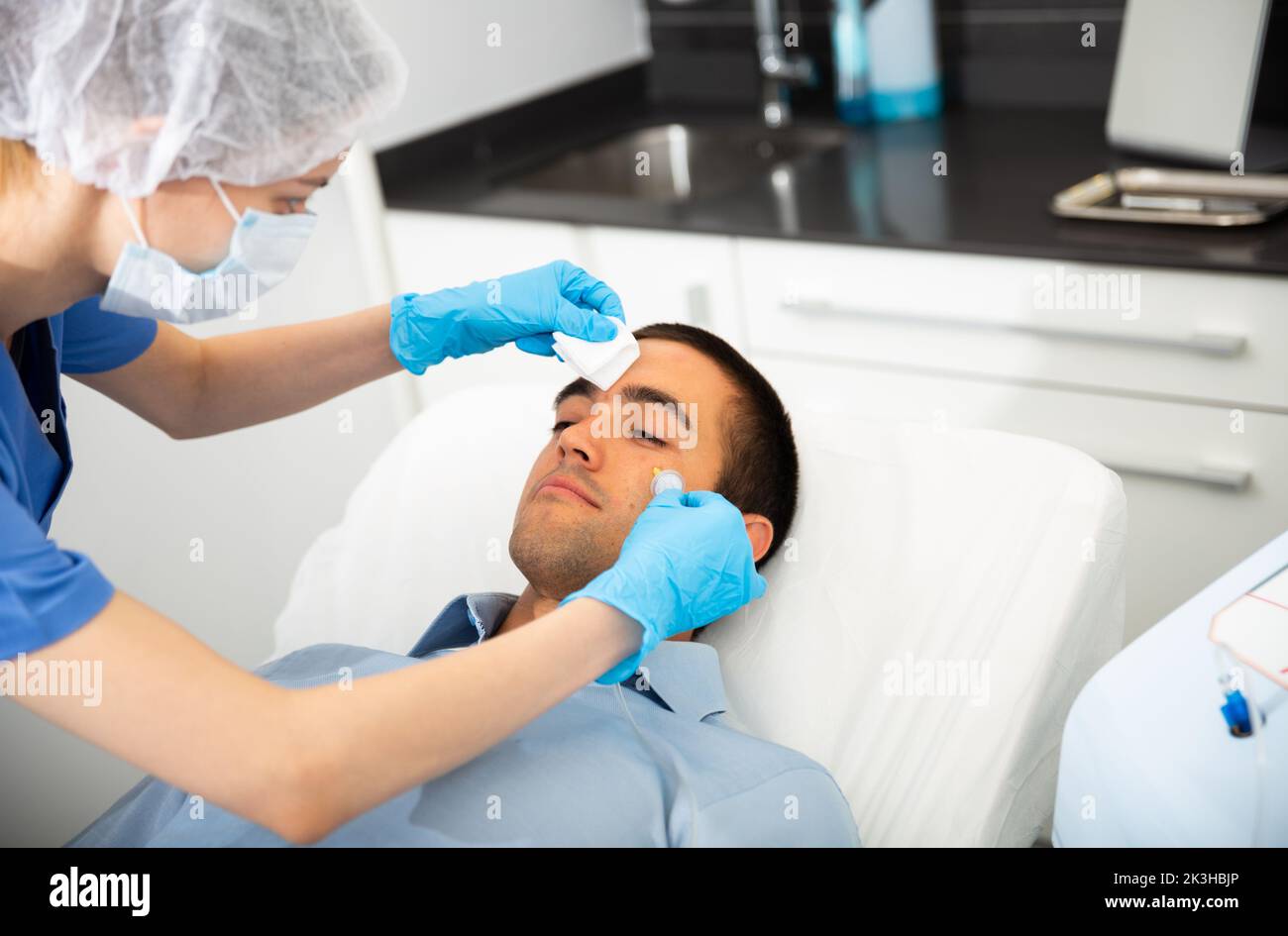 Man receiving carboxytherapy procedure at beauty clinic Stock Photo - Alamy