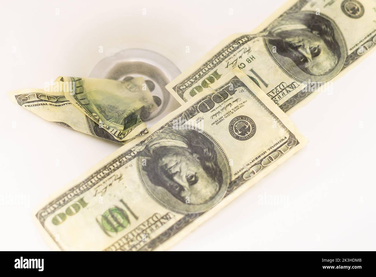 Cleaning a dirty American one hundred dollar bill. money on the black ...