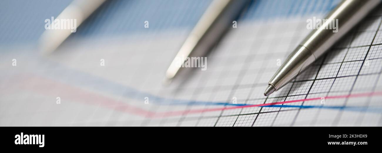 Business paper with graphic, blue and red line in increase and decrease ...