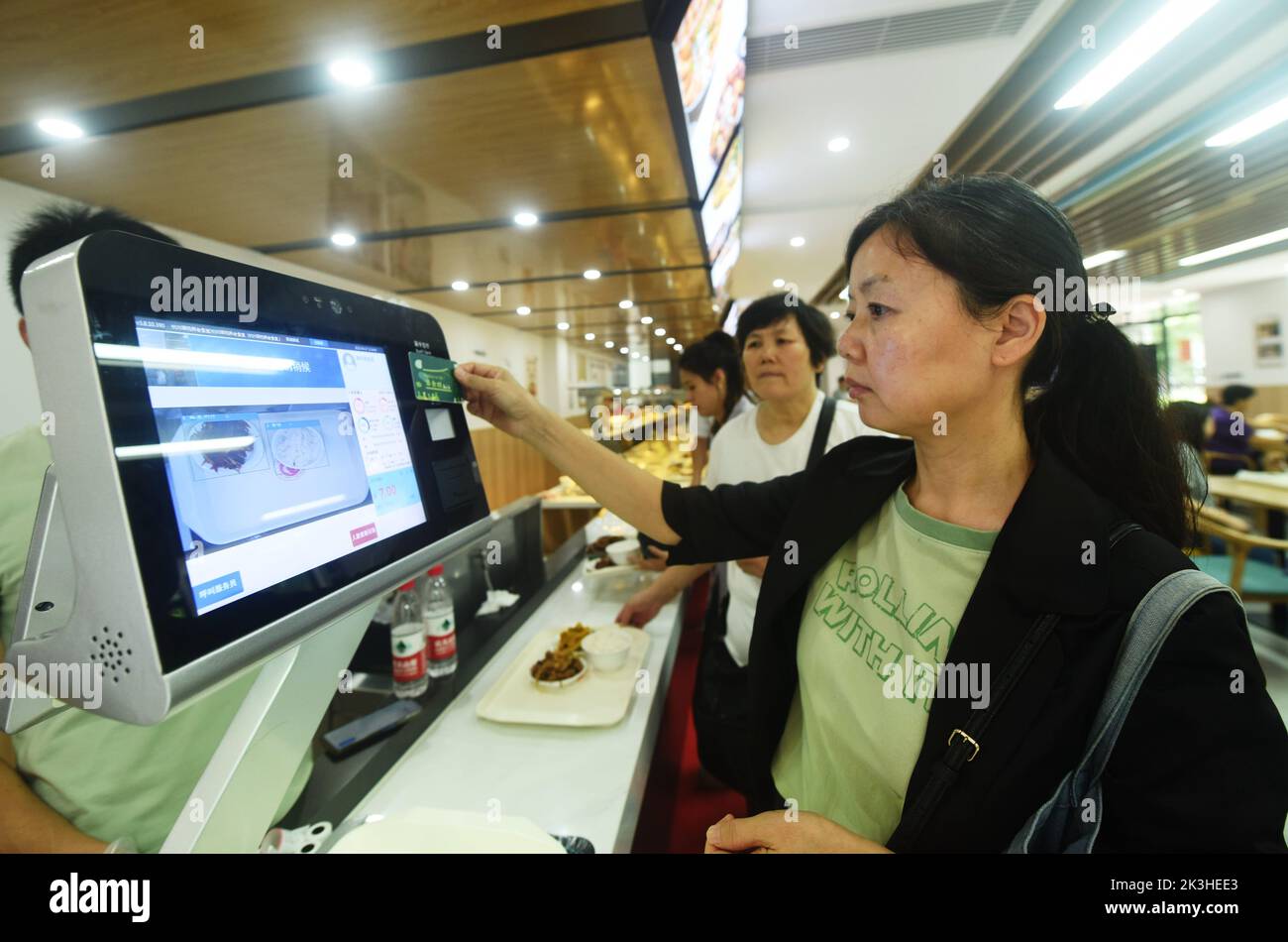 HANGZHOU, CHINA - SEPTEMBER 27, 2022 - Residents buy dishes from an AI ...