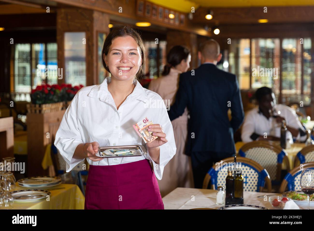 Waiter tip from woman hi-res stock photography and images - Alamy