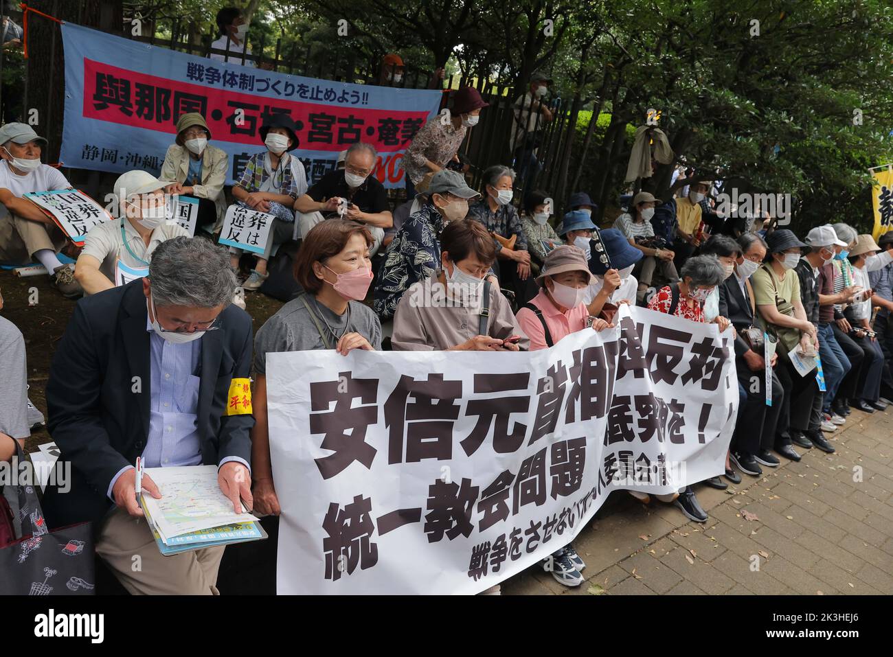 Tokyo, Japan. 27th Sep, 2022. Protesters hold a banner expressing their ...