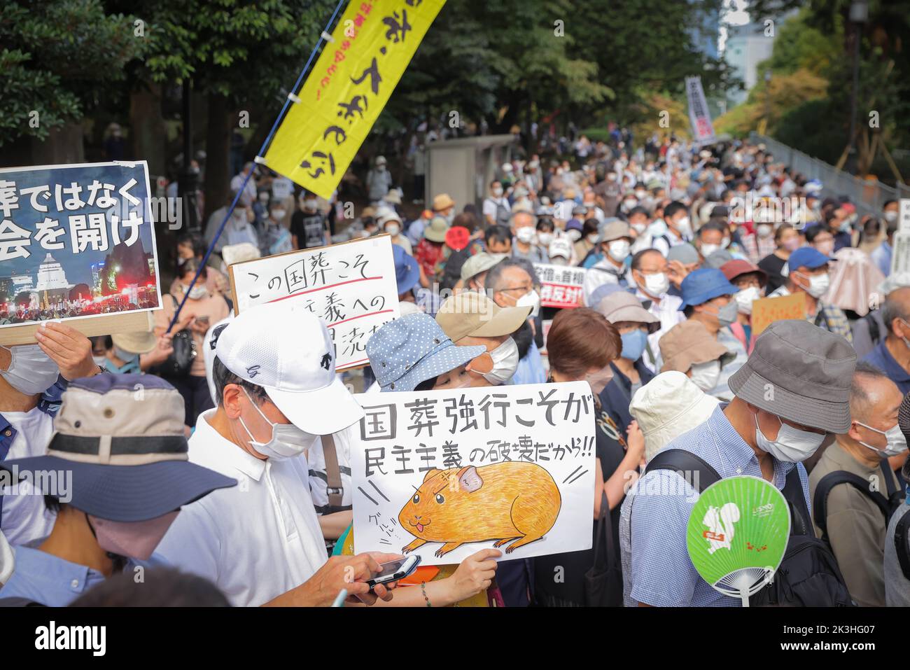 Tokyo, Japan. 27th Sep, 2022. Protesters gather while holding placards ...