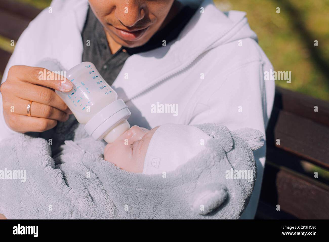 dad feeds the baby from a bottle . baby food. father-son relationship ...