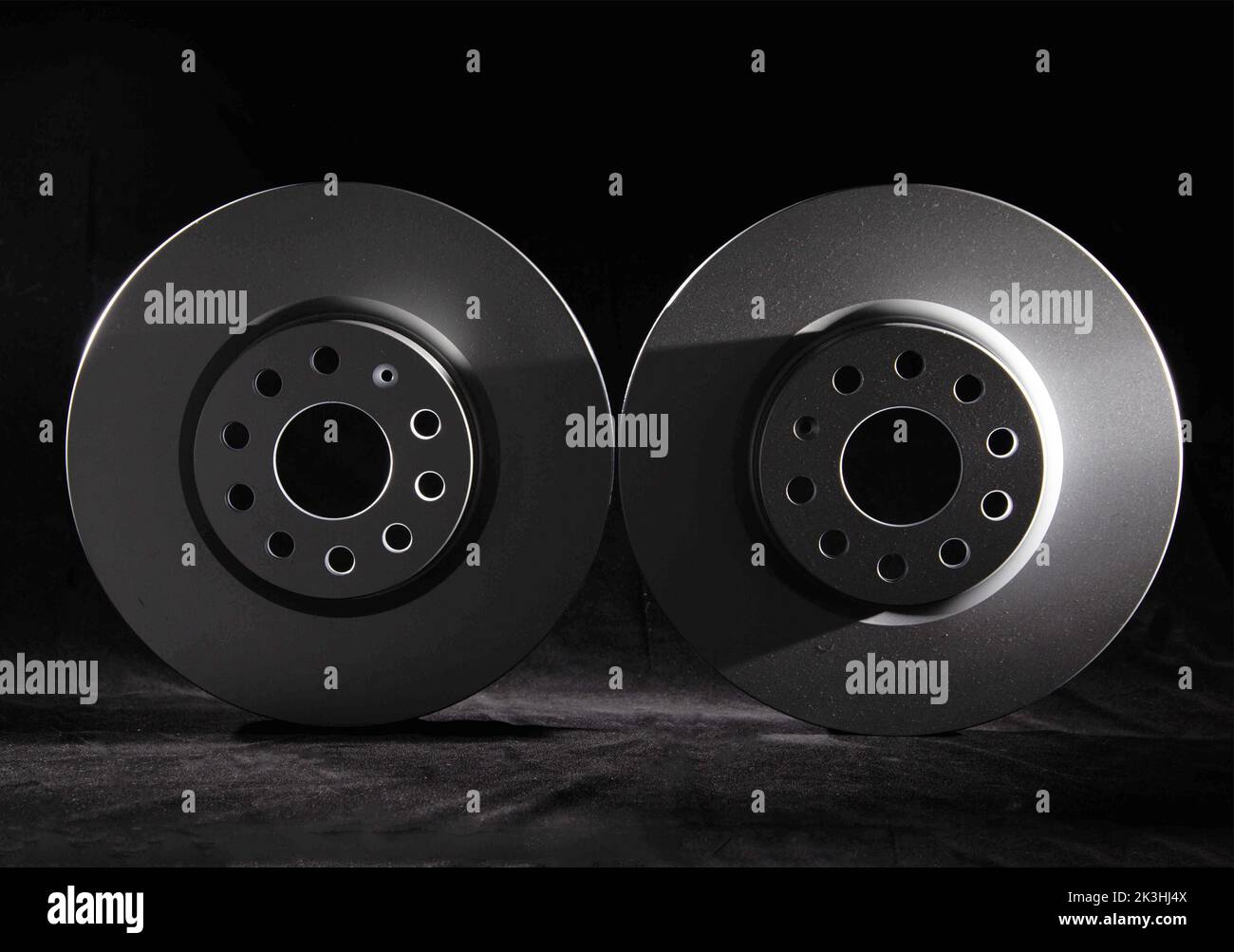 White brake discs on a black background. Efficient braking, safety ...