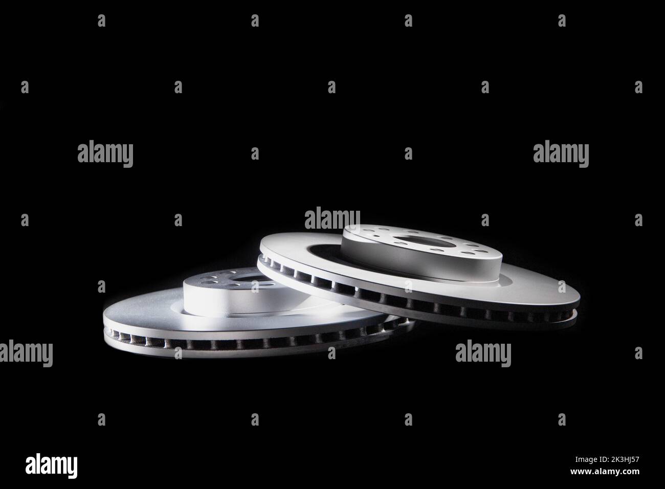 Car brake discs on a black background, isolate. Disc brake system ...