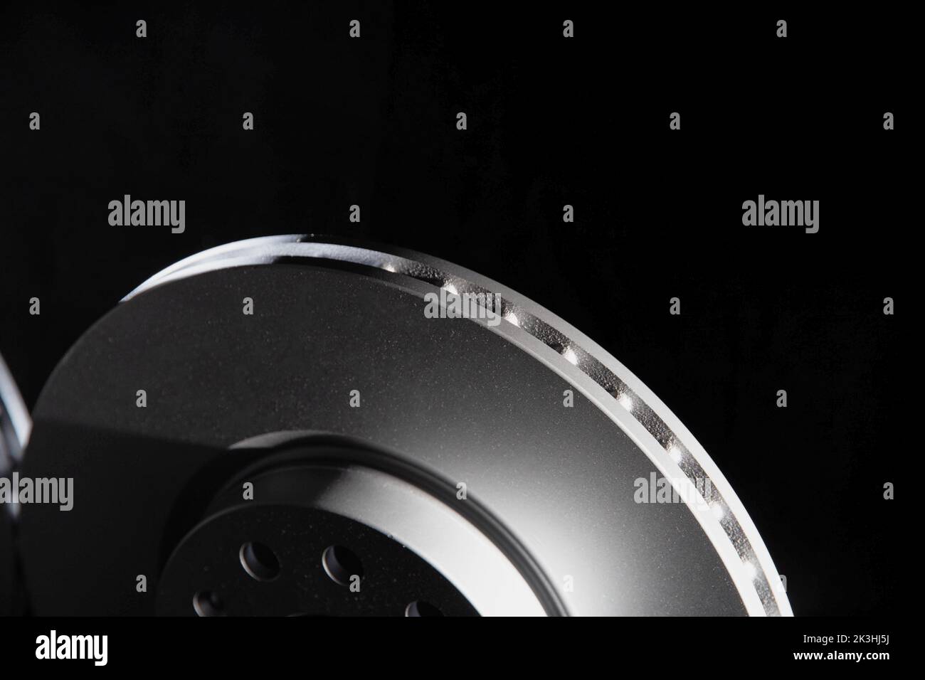 White brake discs on a black background. Efficient braking, safety ...