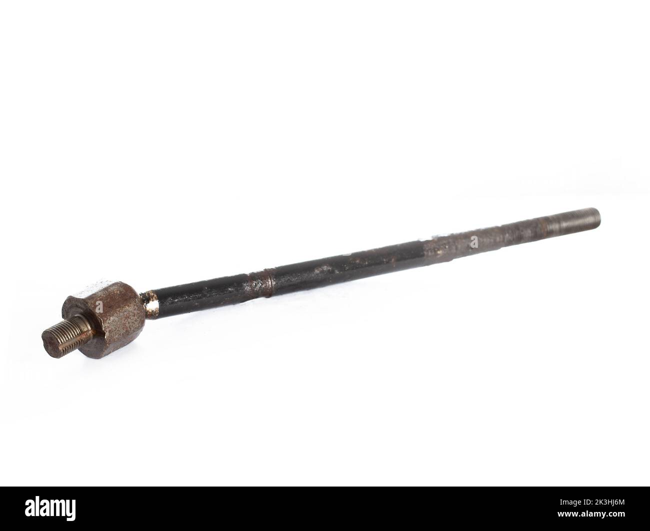 Old rusty steering rod on a white background, close-up. Isolate ...