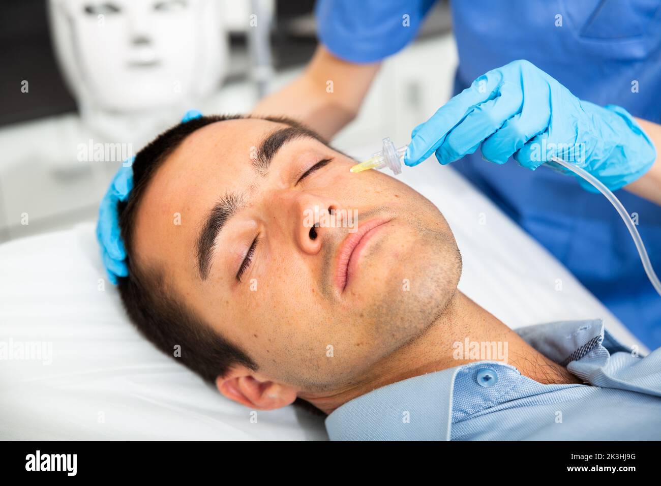Man receiving carboxytherapy procedure at beauty clinic Stock Photo - Alamy