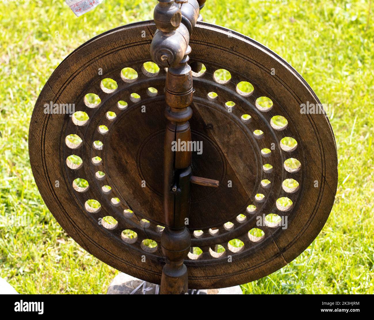 Antique vintage spinning wheel, wooden tool in the form of a wheel ...