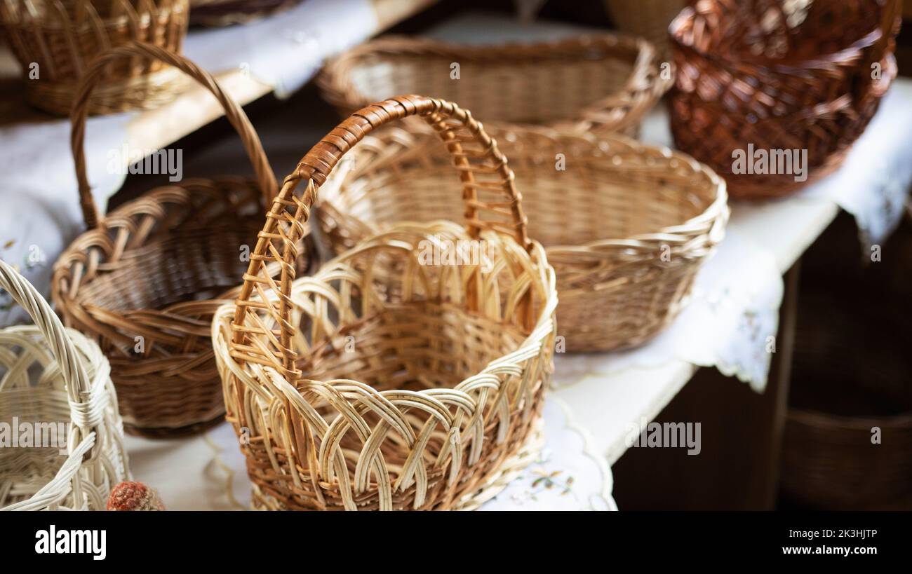 Beautiful wicker baskets on the table. Brown textured picnic and food ...