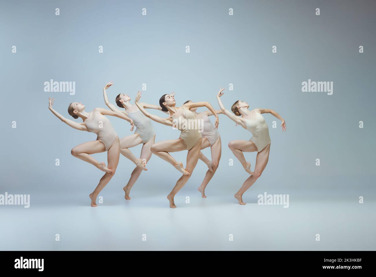 Group of young girls, ballet dancers performing, posing isolated over ...