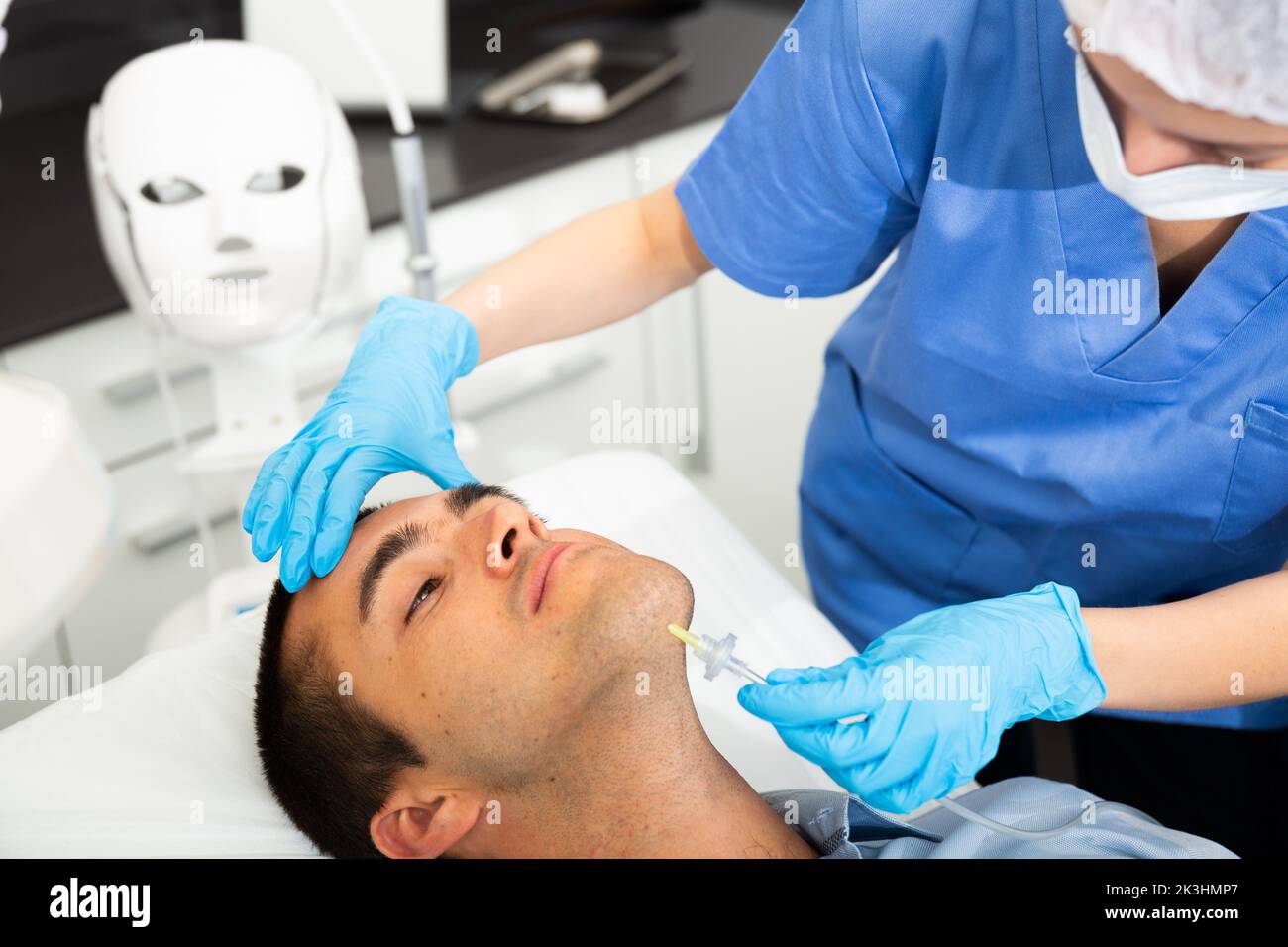 Man receiving carboxytherapy procedure for facial skin Stock Photo - Alamy