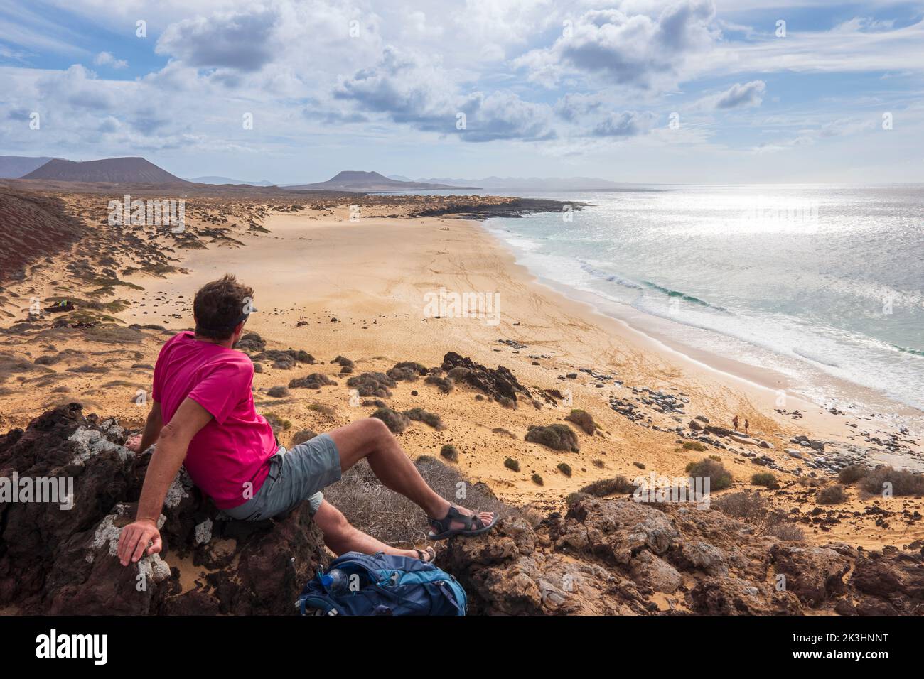 Adventurer man hiking along the virgin beaches on the island of La ...