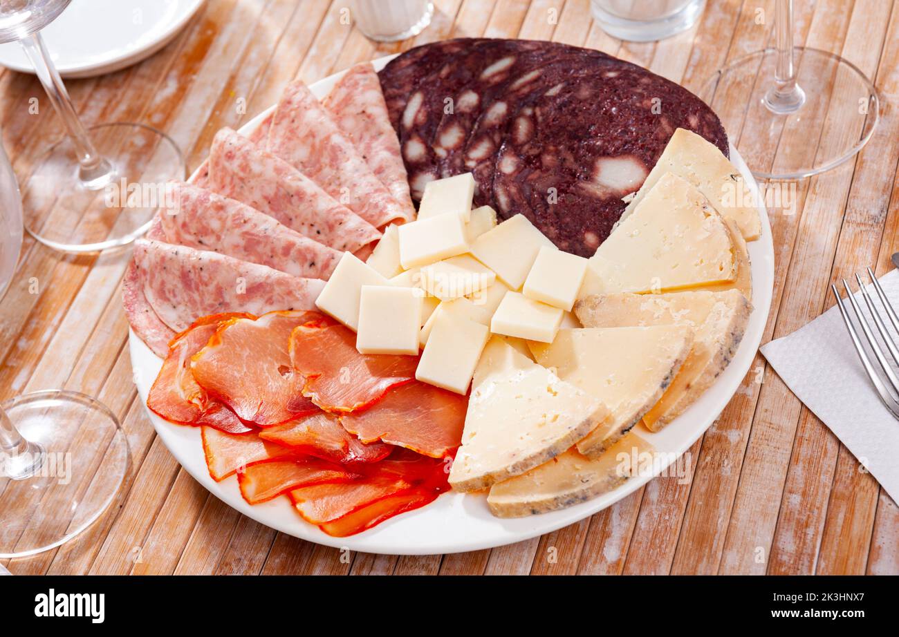 Meat platter with blood sausage and cheese Stock Photo - Alamy