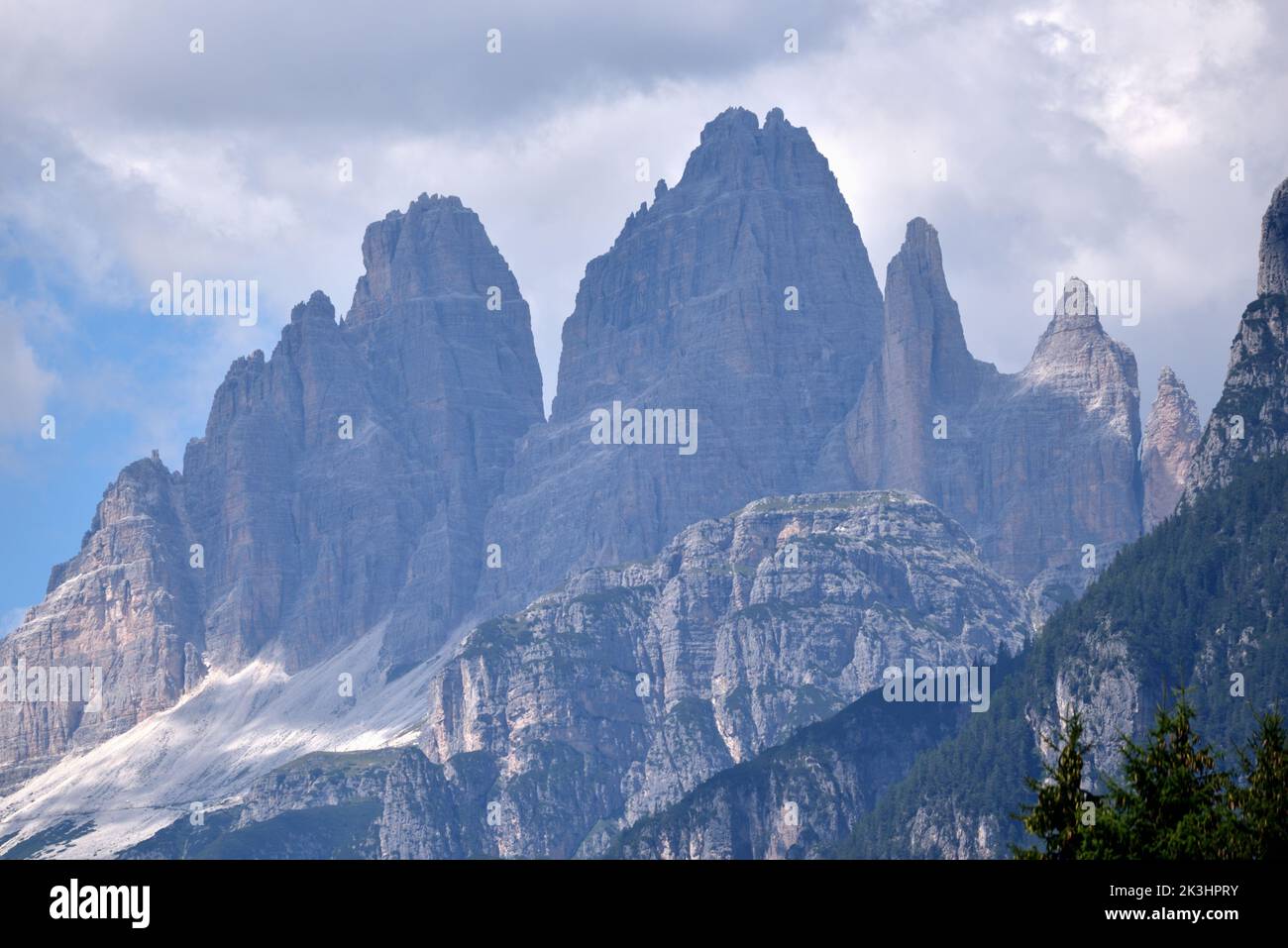 The group of Tre Cime di Lavaredo seen from the lake of the town of ...