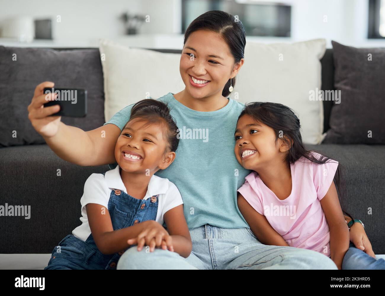 Selfie, family and children with a girl, daughter and foster mother taking a photograph in a ...