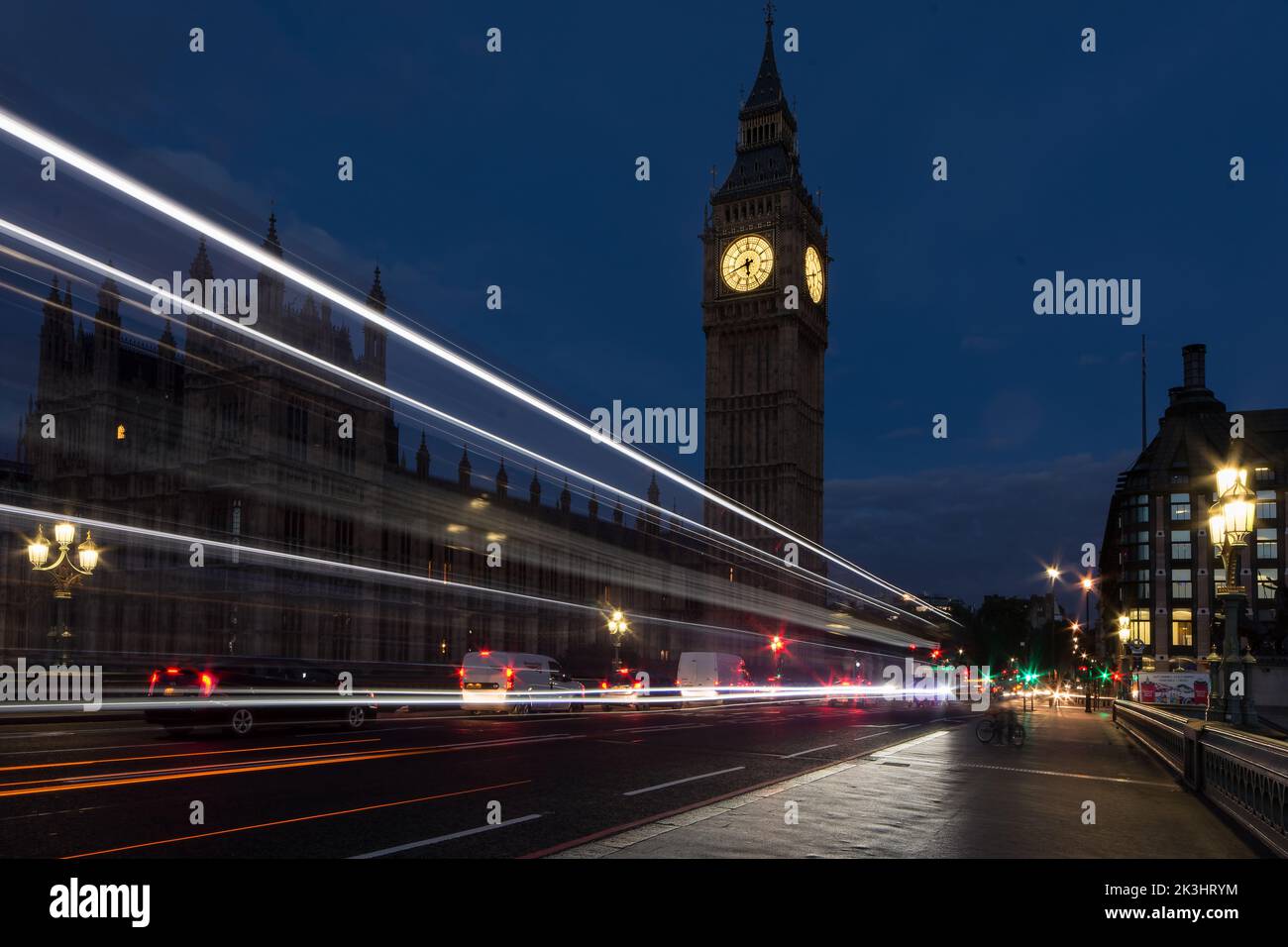 Night Bus passing Houses of Parliament and Big Ben. Early evening ...