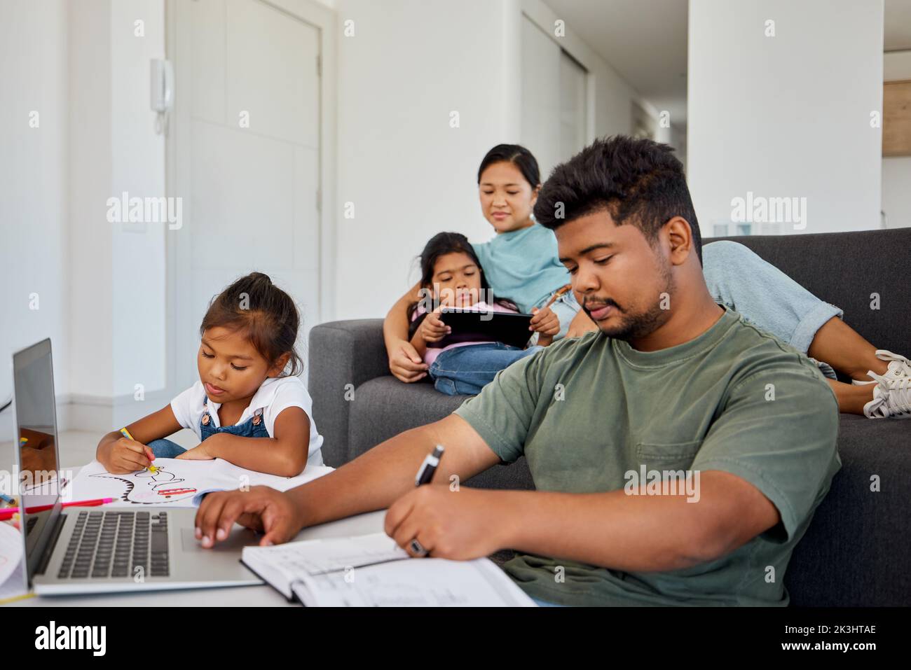 Family, children and education with a father working from home and his ...