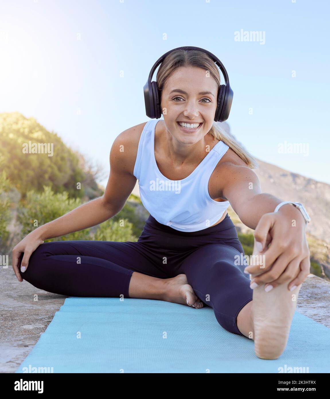 Workout yoga stretch, music streaming headphones and woman outdoor on a ...