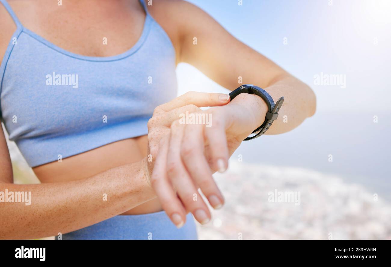 Fitness, woman and hands for time on watch checking or monitoring ...