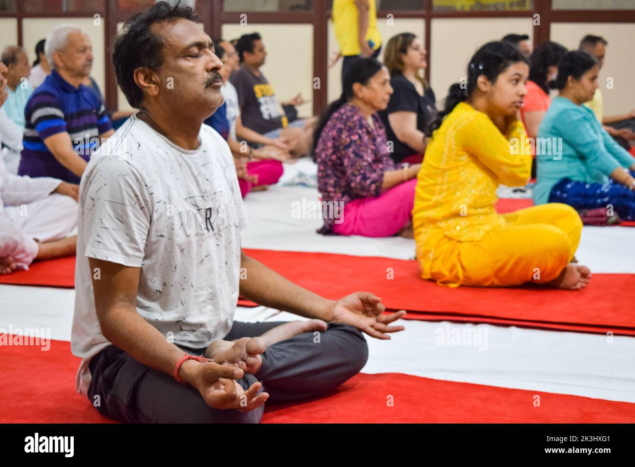 New Delhi, India, June 19 2022 -Group Yoga exercise session for people ...