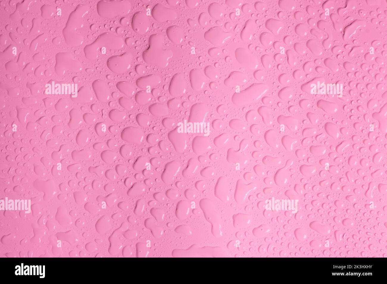 Pink background with water drops top view Stock Photo - Alamy