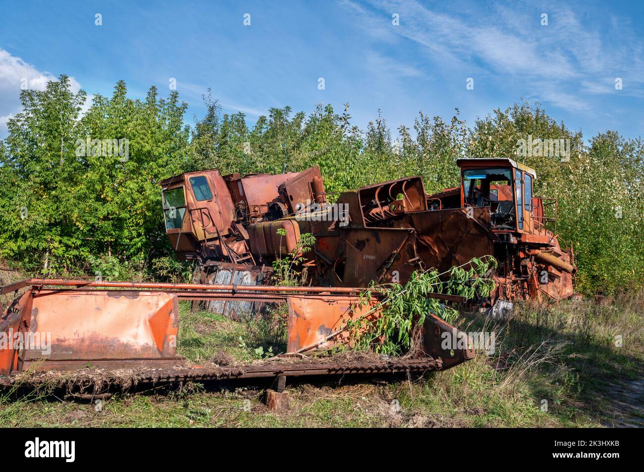 Old rusty agricultural machinery. Abandoned harvester, tractor Stock ...