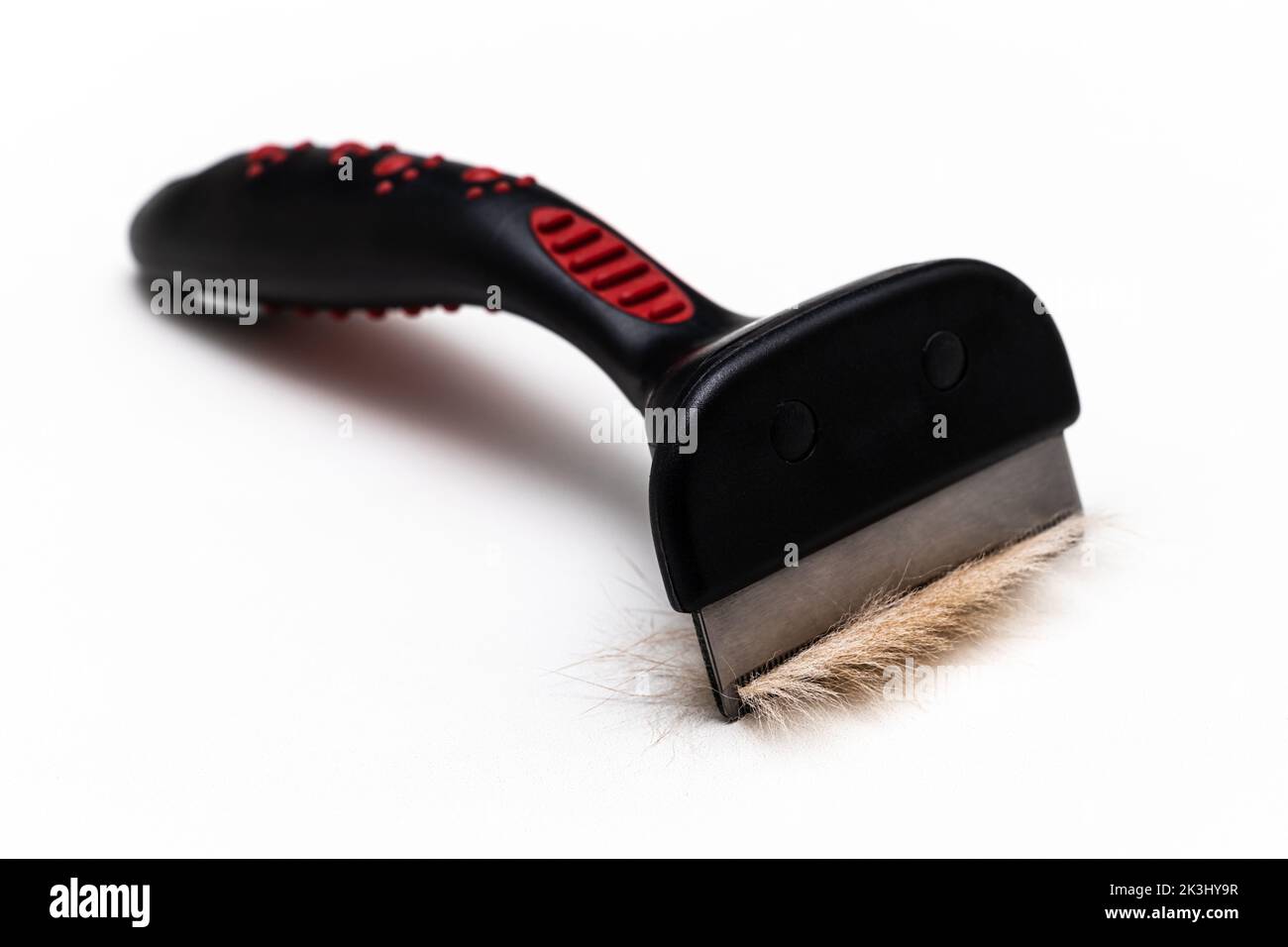 comb for combing wool from animals on a white background. cat comb ...