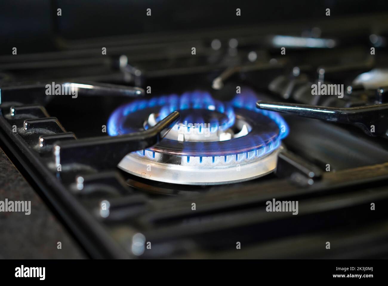 Gas energy crisis. Blue flame on a cooker gas ring Stock Photo - Alamy