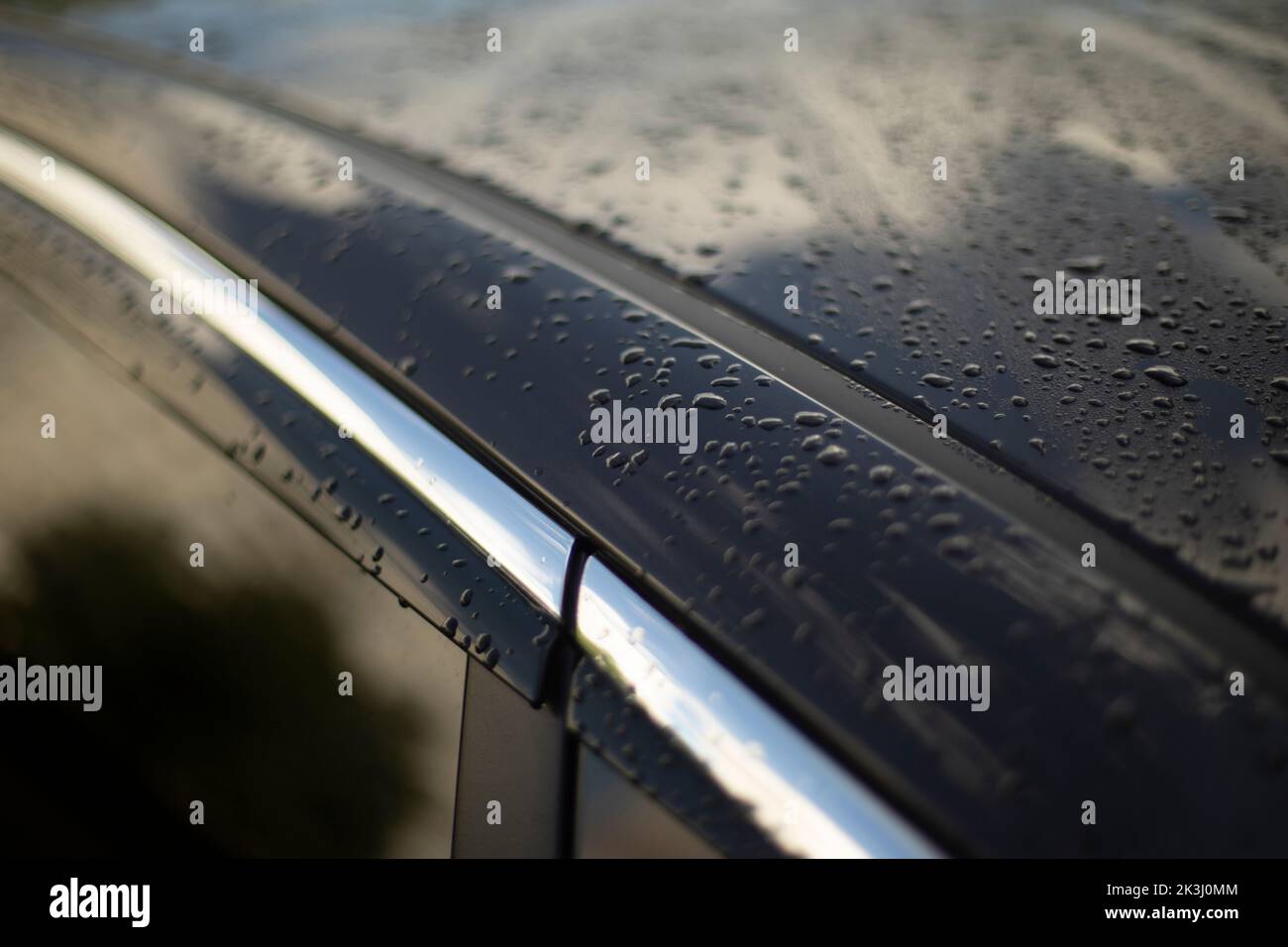 Wet surface of car. Drops on black car. Transport details. Black car ...