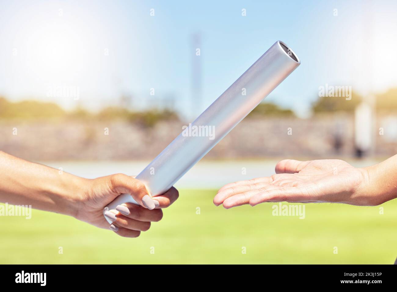 Teamwork, sports and hands of runner with relay race with baton in ...