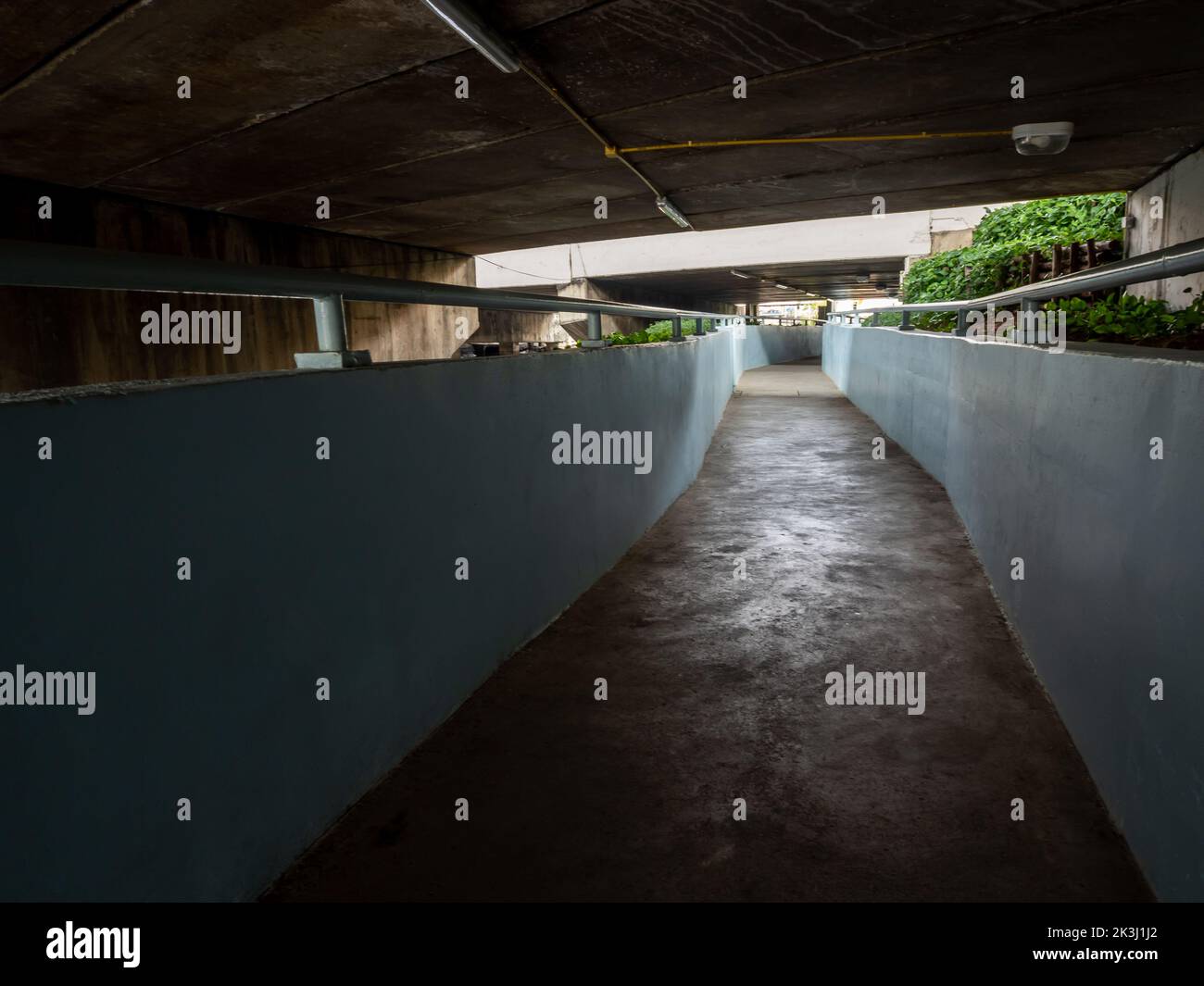 underpass walkway under the street beside the drainage canal Stock ...