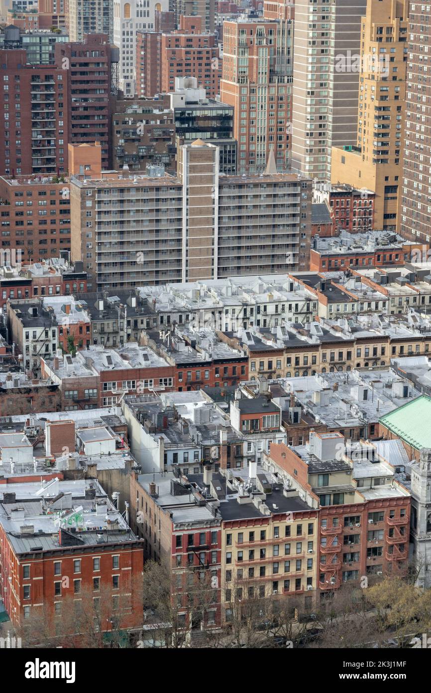 A view of the roofs of the Upper East Side of Manhattan with trees and ...