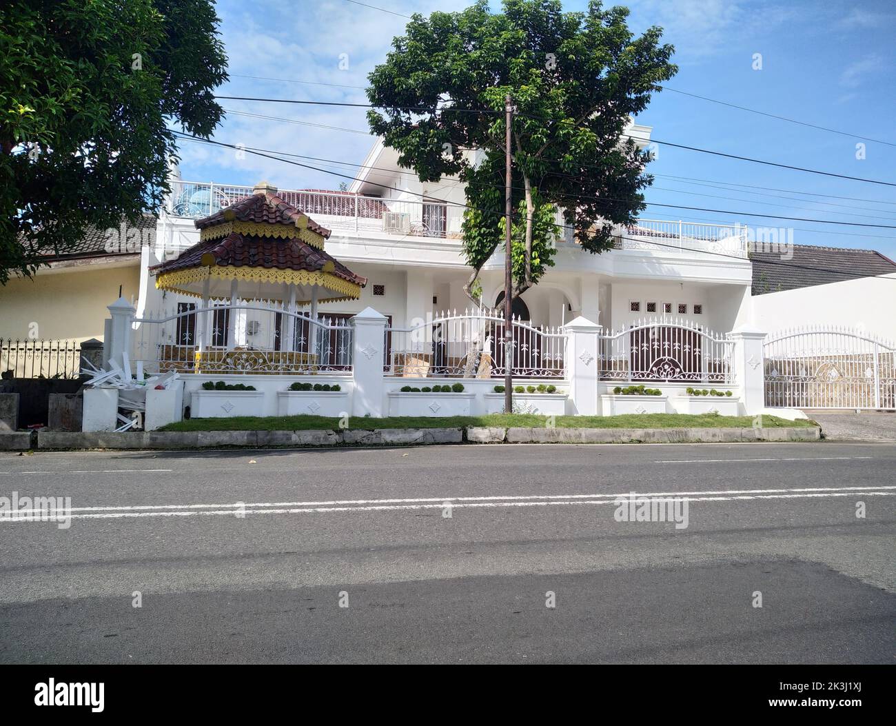 A white house at the road in Medan on a sunny day Stock Photo - Alamy