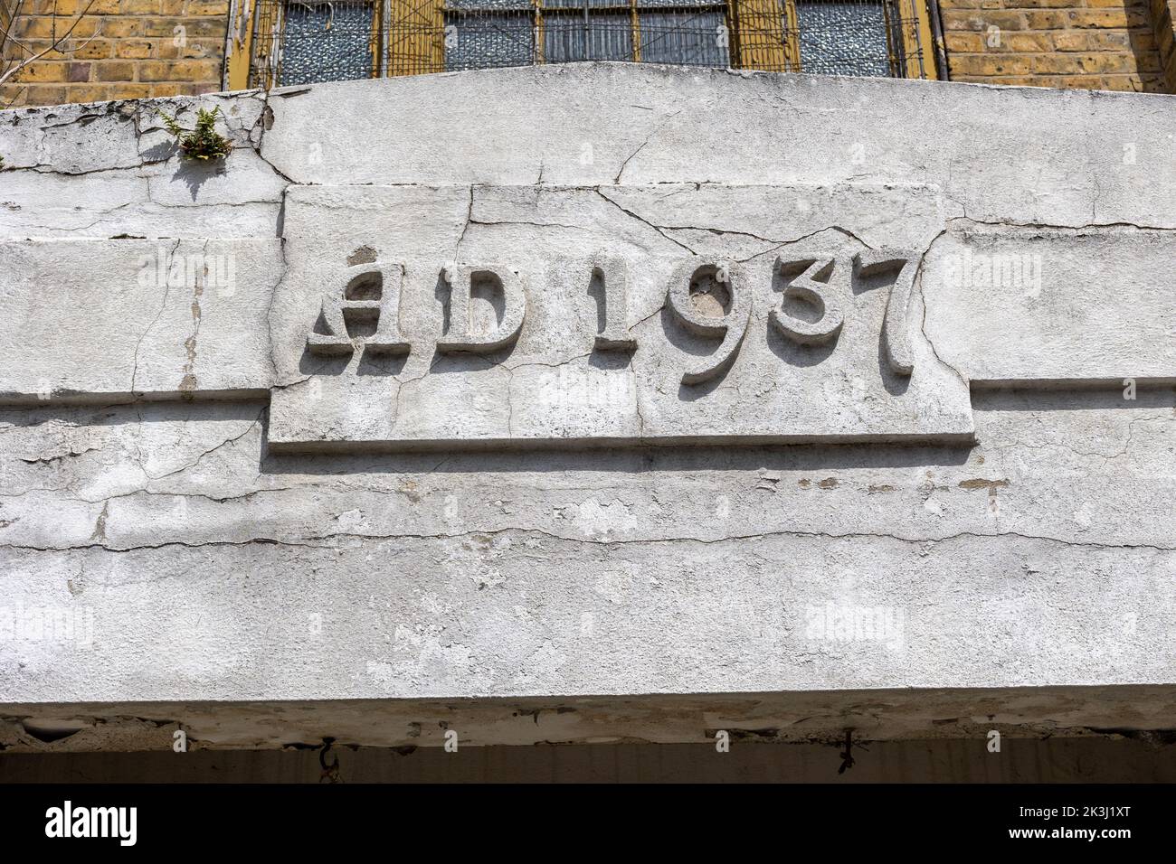 An old AD 1937 rock sign on the exterior of a friary church Stock Photo ...