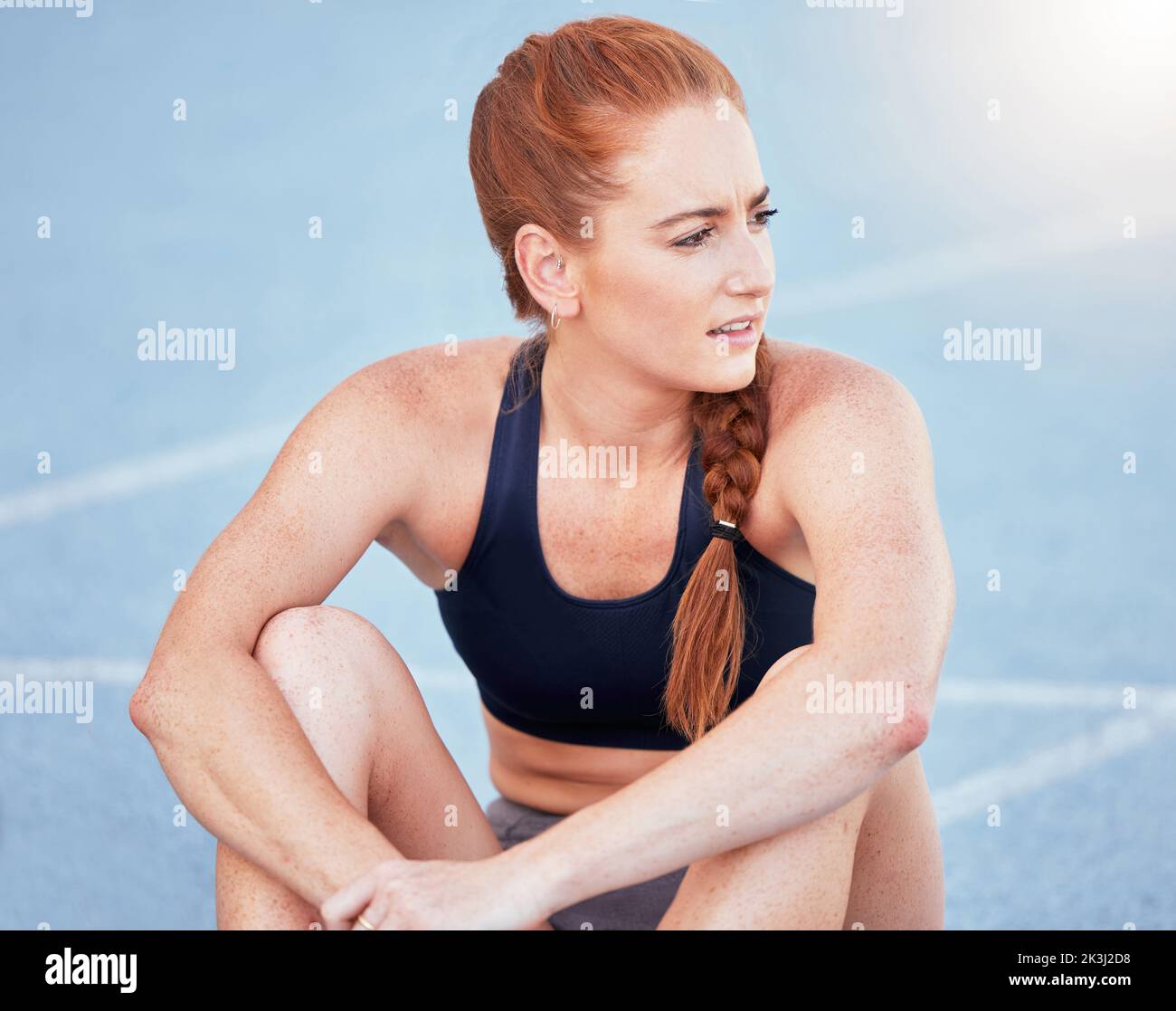 Sports track, fitness and runner on break while training for marathon or olympic competition ...