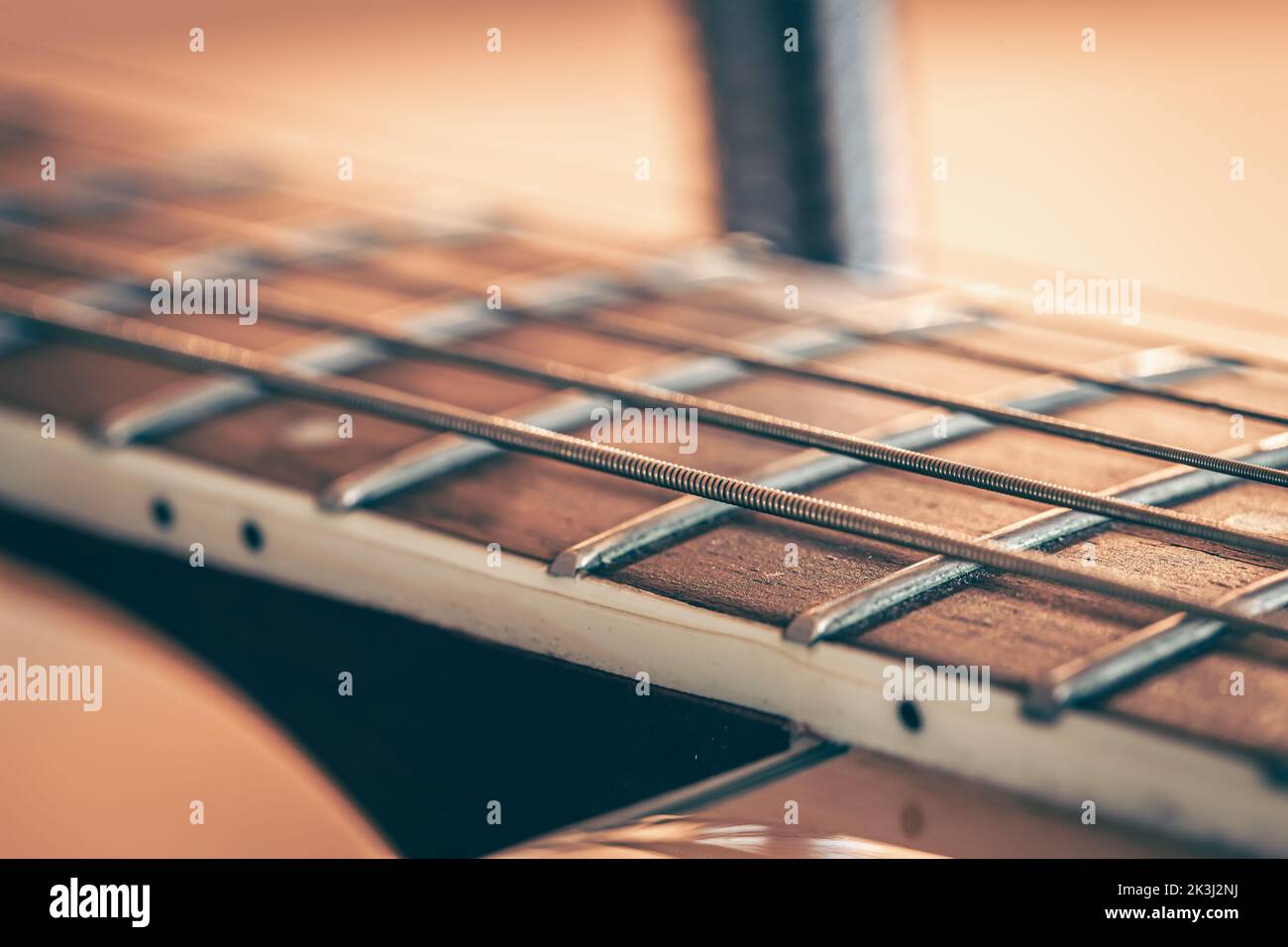 Guitar neck with a metal string, macro photography Stock Photo - Alamy