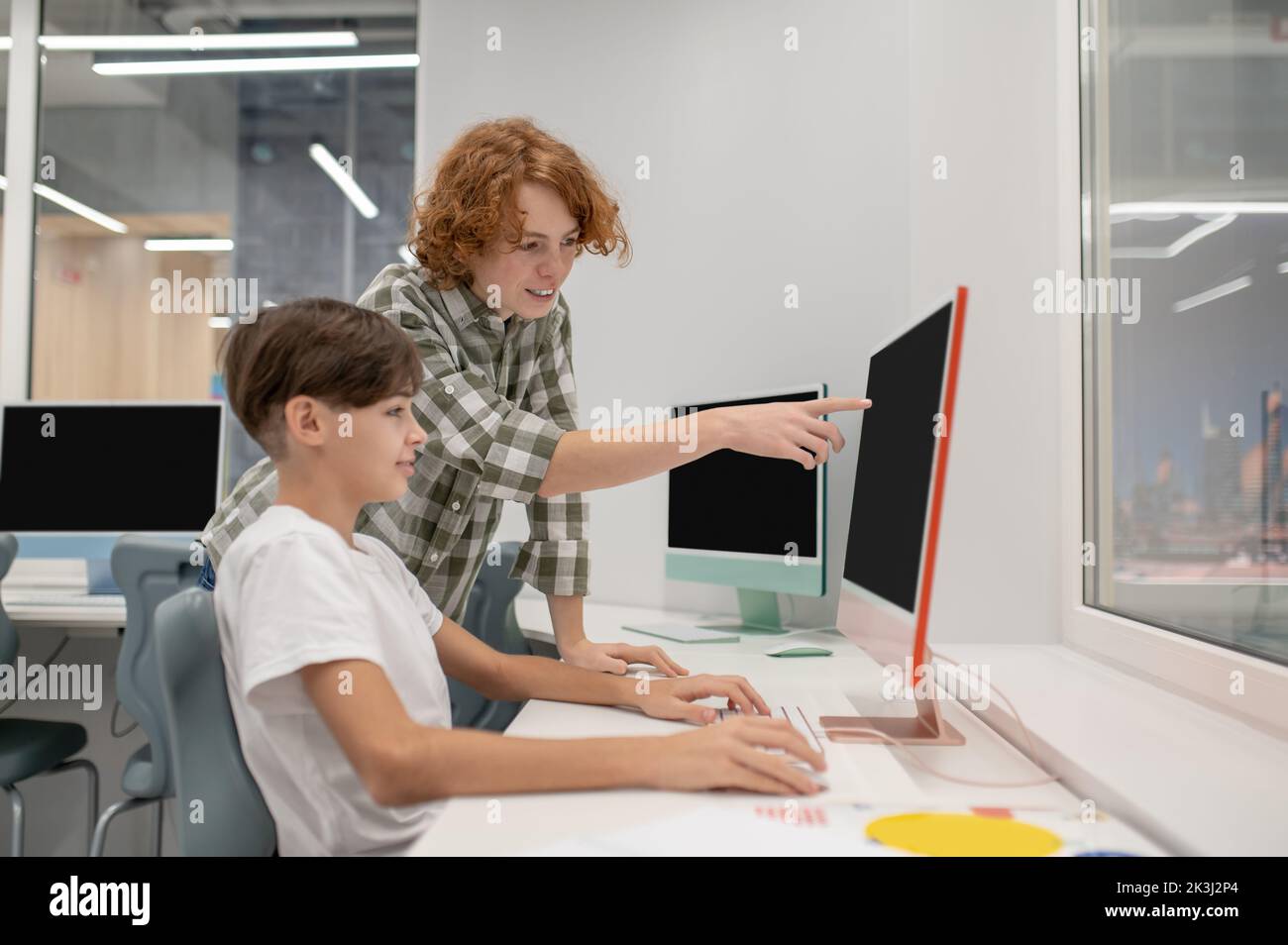 Schoolboys working on computers at IT lesson at school Stock Photo - Alamy