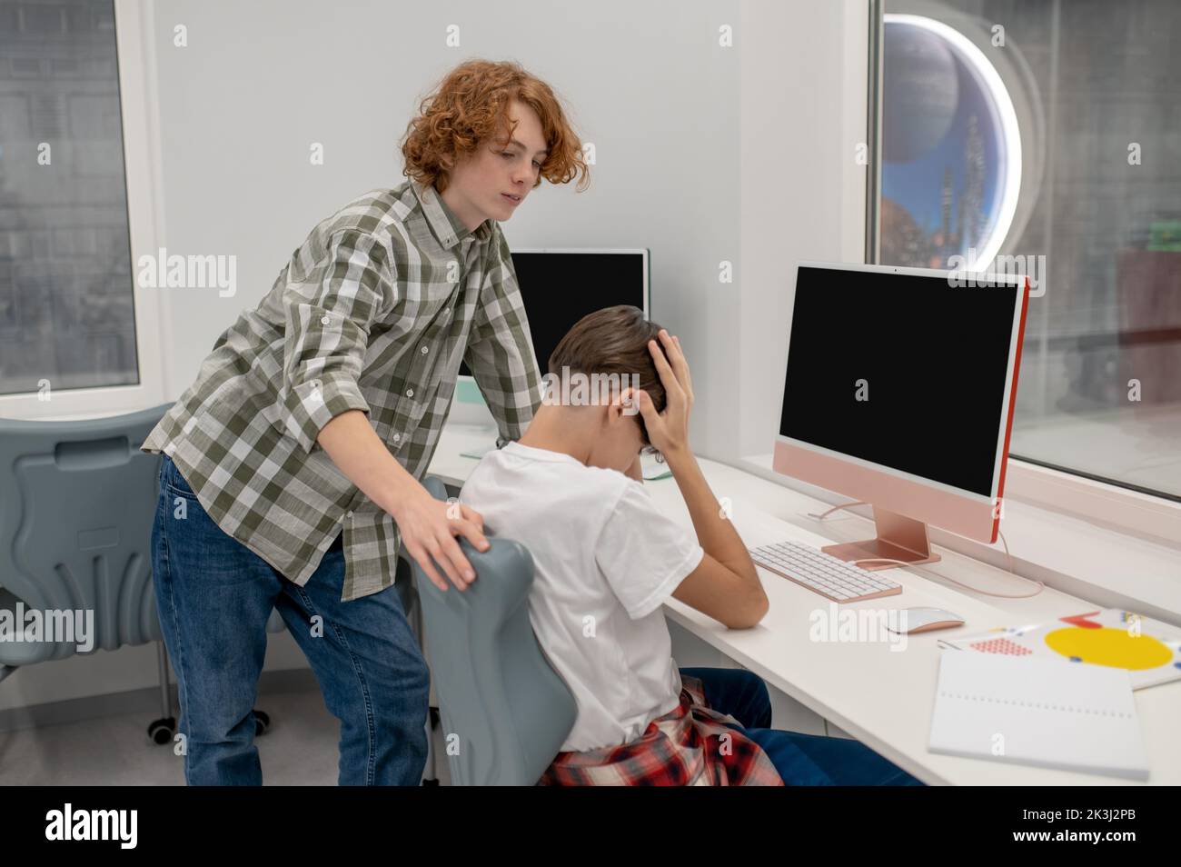 Schoolboys working on computers at IT lesson at school Stock Photo - Alamy